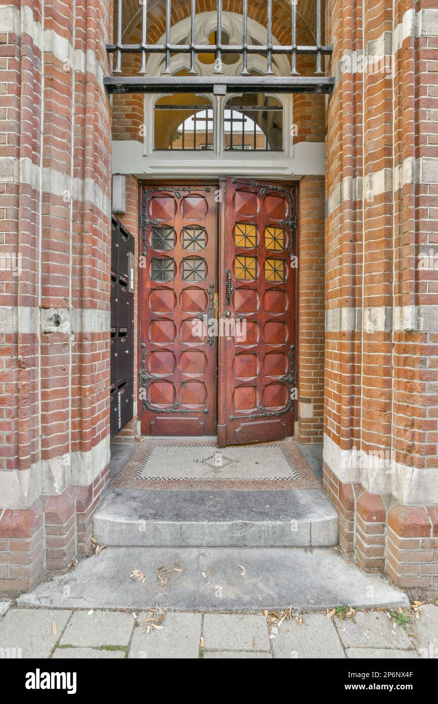 Amsterdam, Netherlands - 10 April, 2021: a brick building with a red ...
