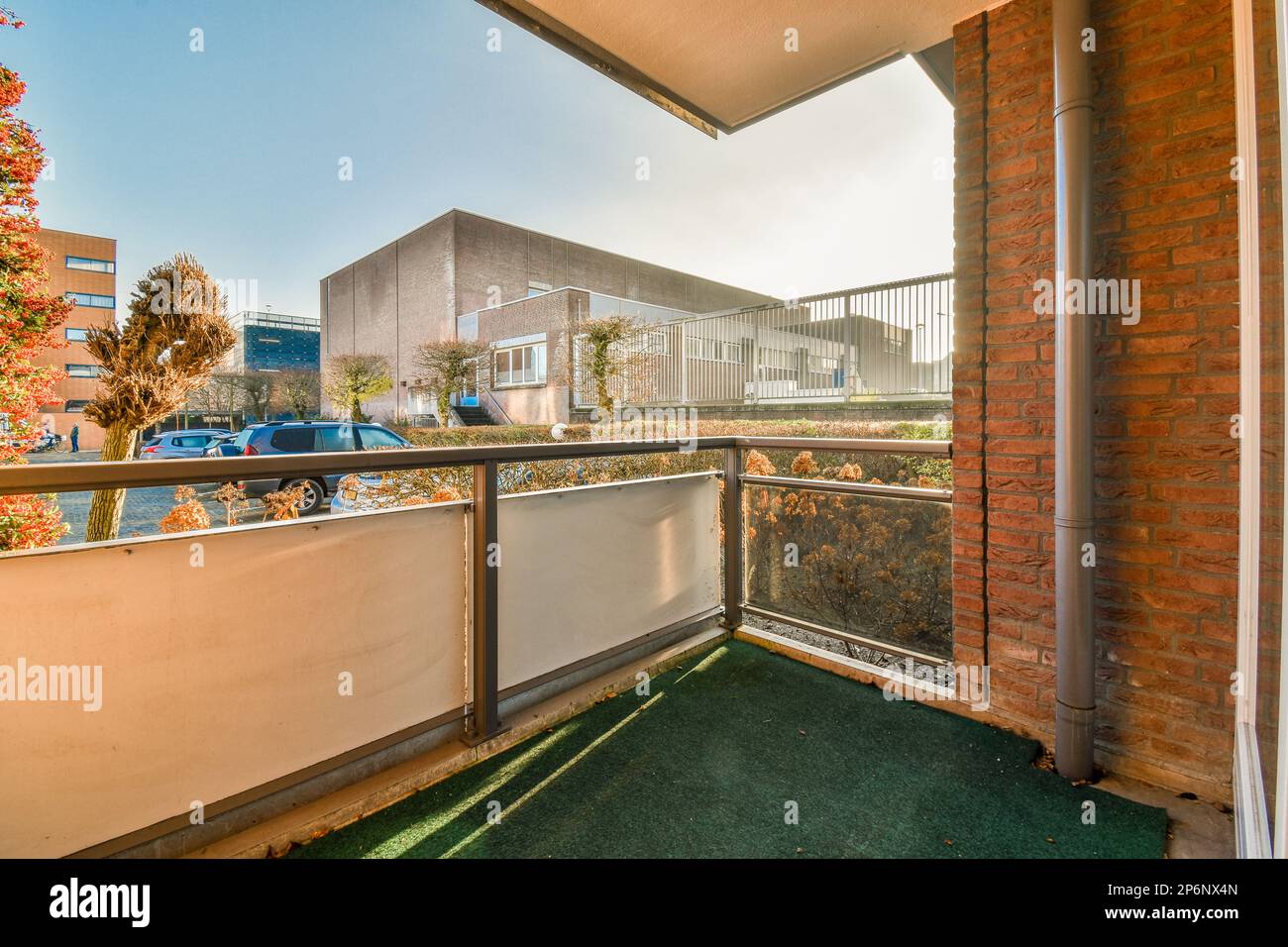 an outside area with some plants and buildings in the background, as ...
