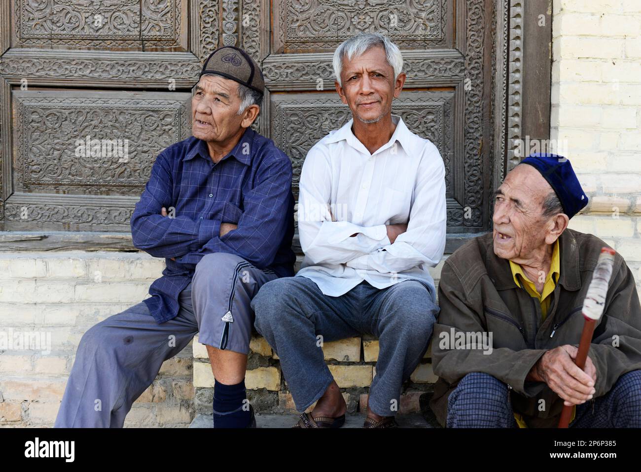 Uzbek men sitting outside a shop in Bukhara, Uzbekistan Stock Photo - Alamy