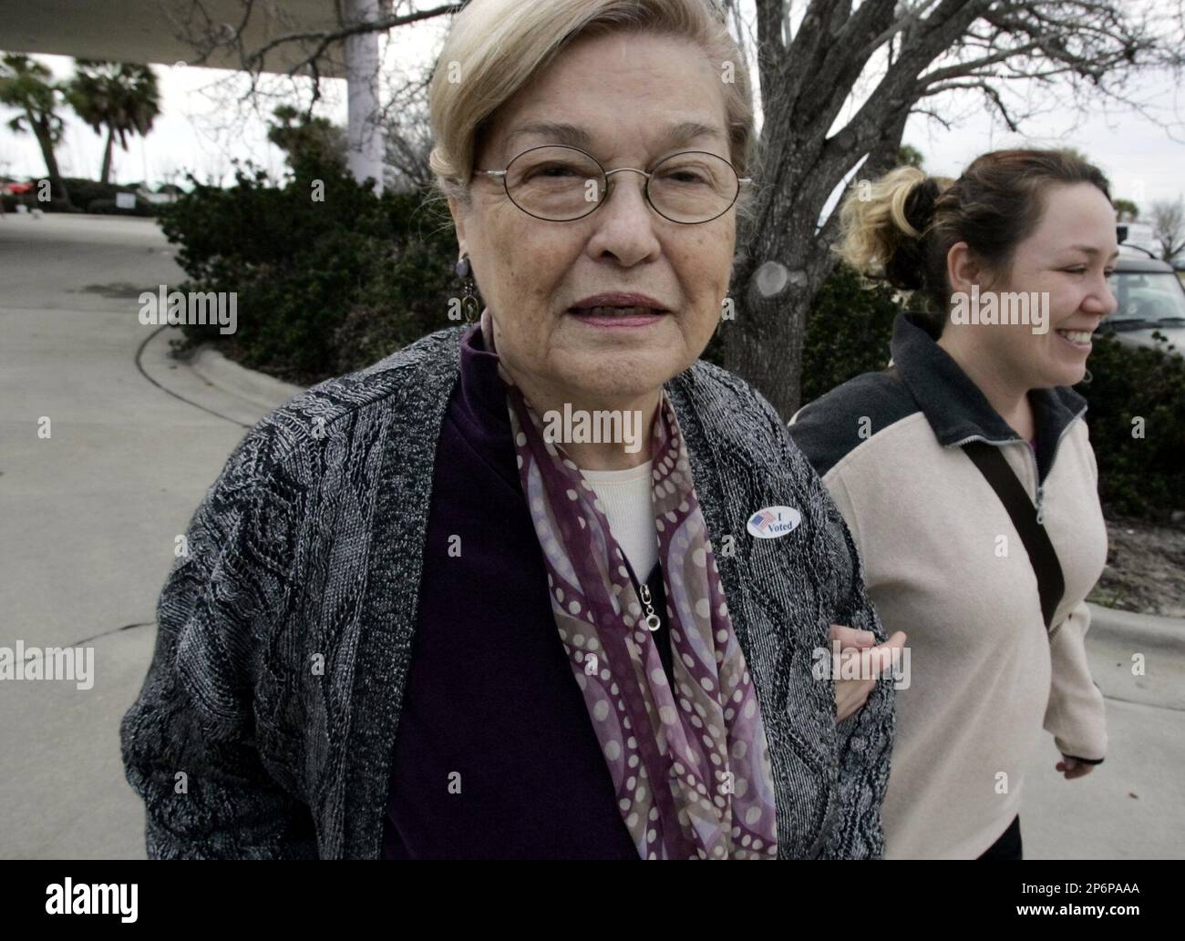 Myrtice Hutchison, left, of Panama City, Fla. walks with Laura Gamez ...