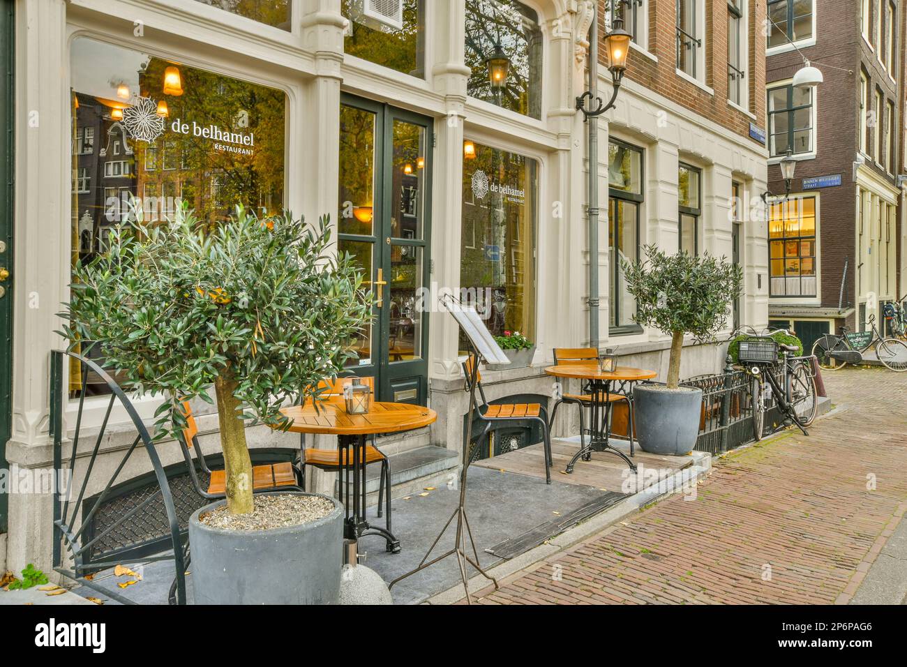 Amsterdam, Netherlands - 10 April, 2021: a sidewalk with tables and ...
