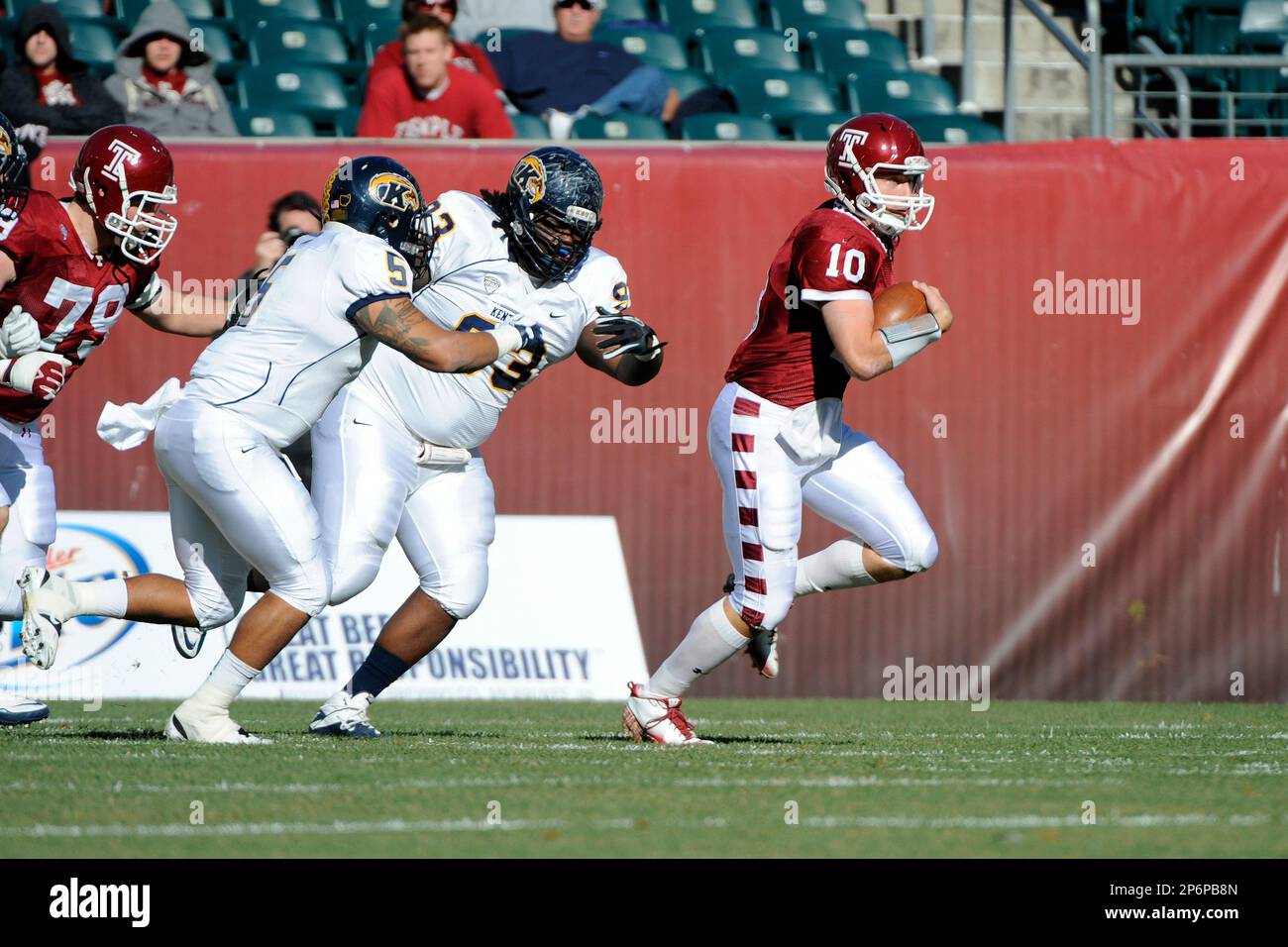 Temple University Owls quarterback Chris Coyer (10) avoids Kent State ...