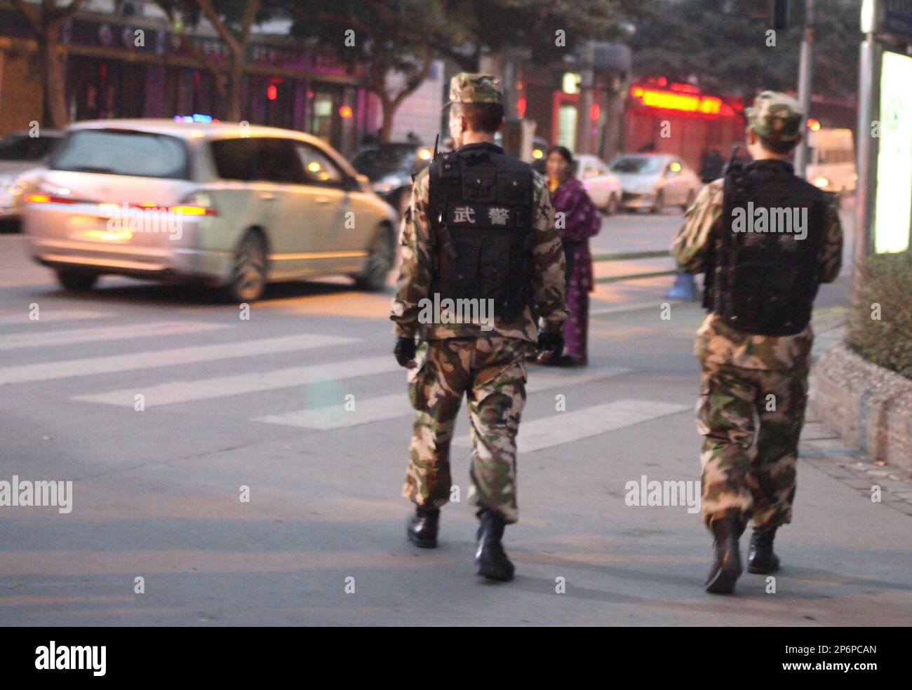 Armed policemen patrol on a street at the Wuhou Temple in Chengdu in ...