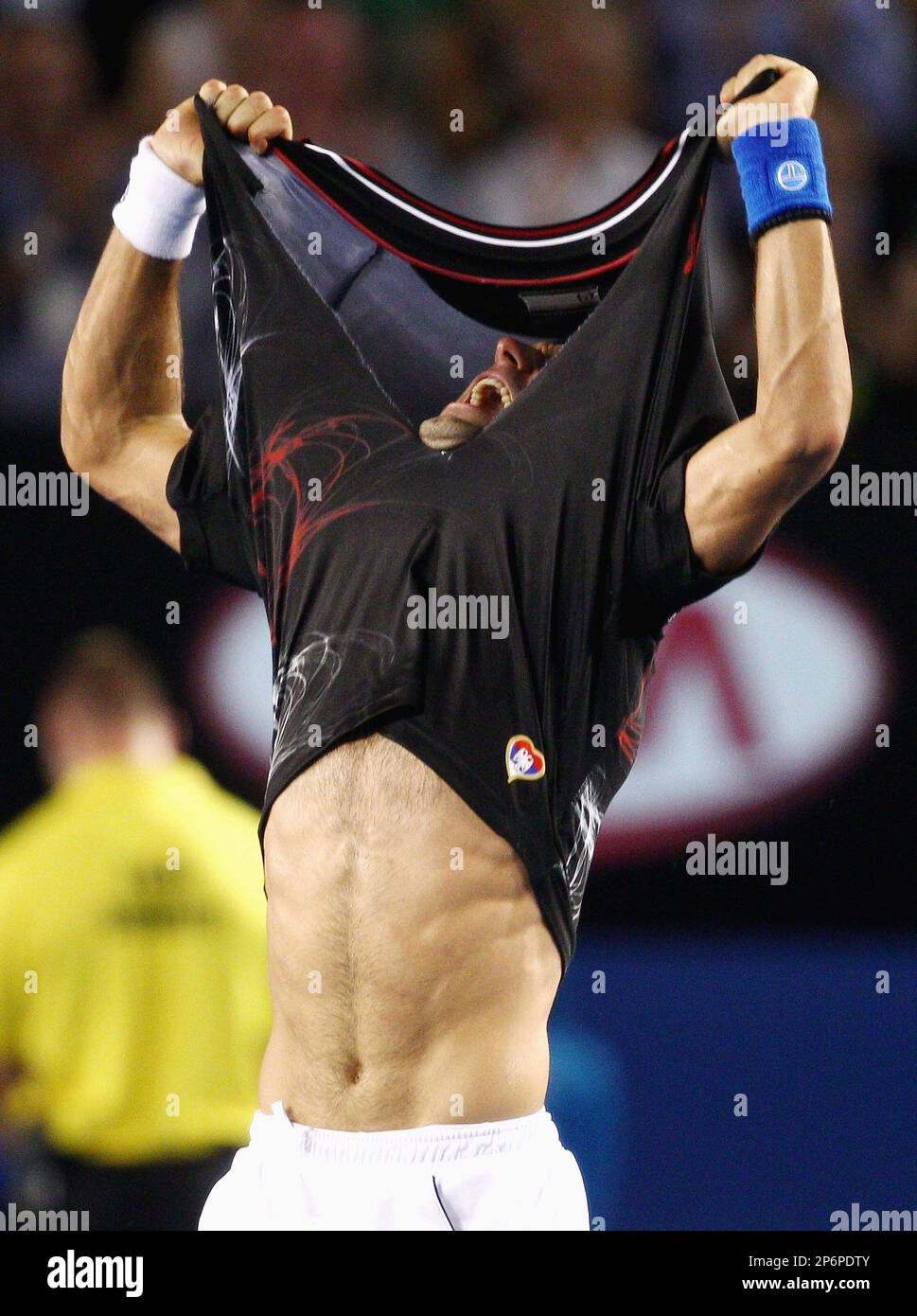 Serbia's Novak Djokovic celebrates by ripping his shirt off after ...
