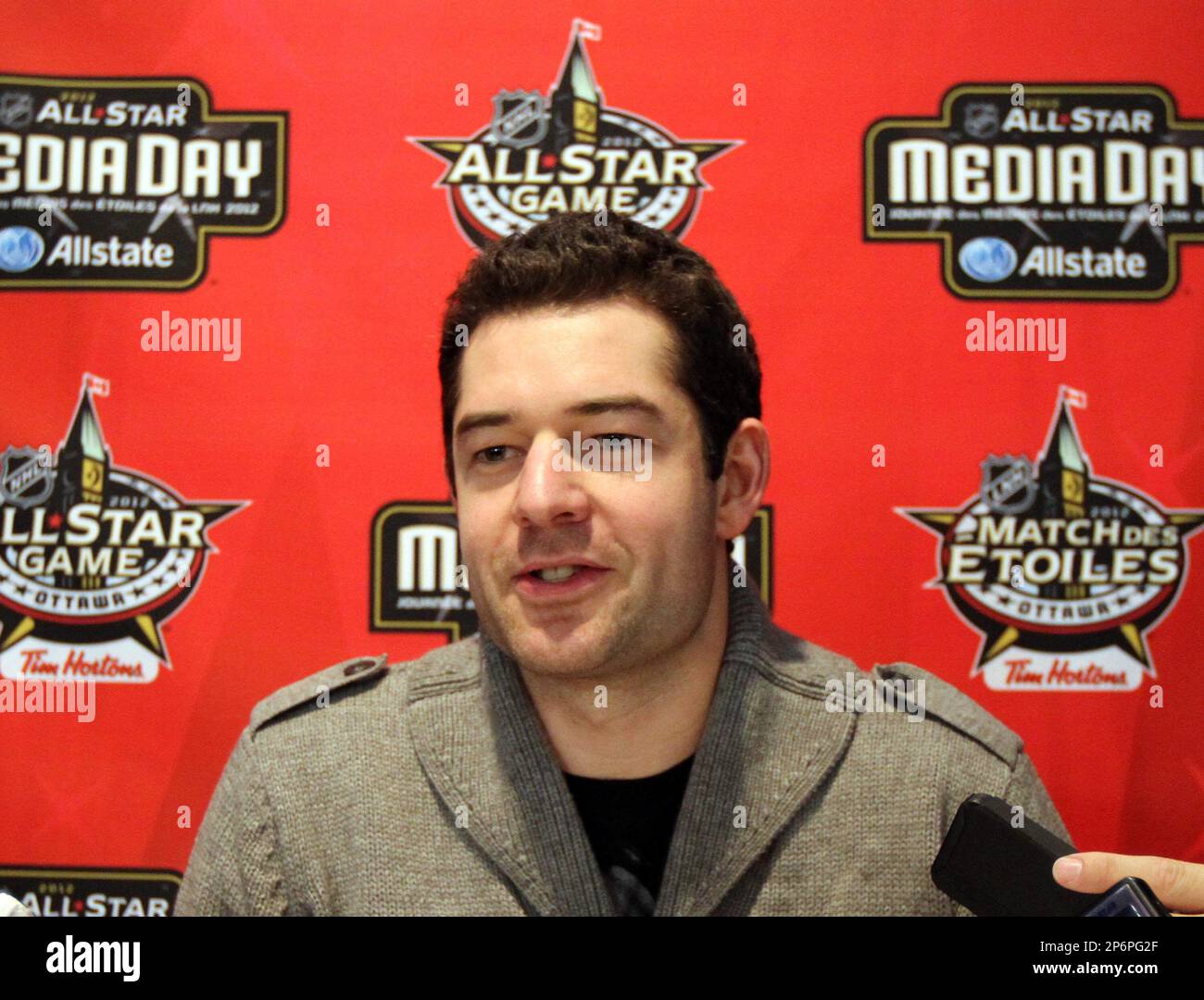 St. Louis Blues' Brian Elliott talks to reporters during the NHL All Star hockey game media ...