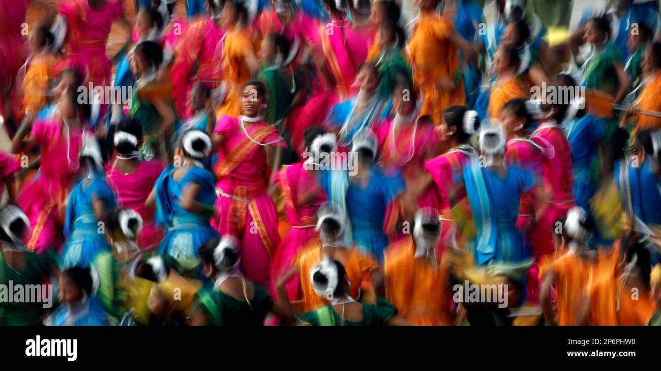 Indian girls wear traditional clothing as they dance for dignitaries ...