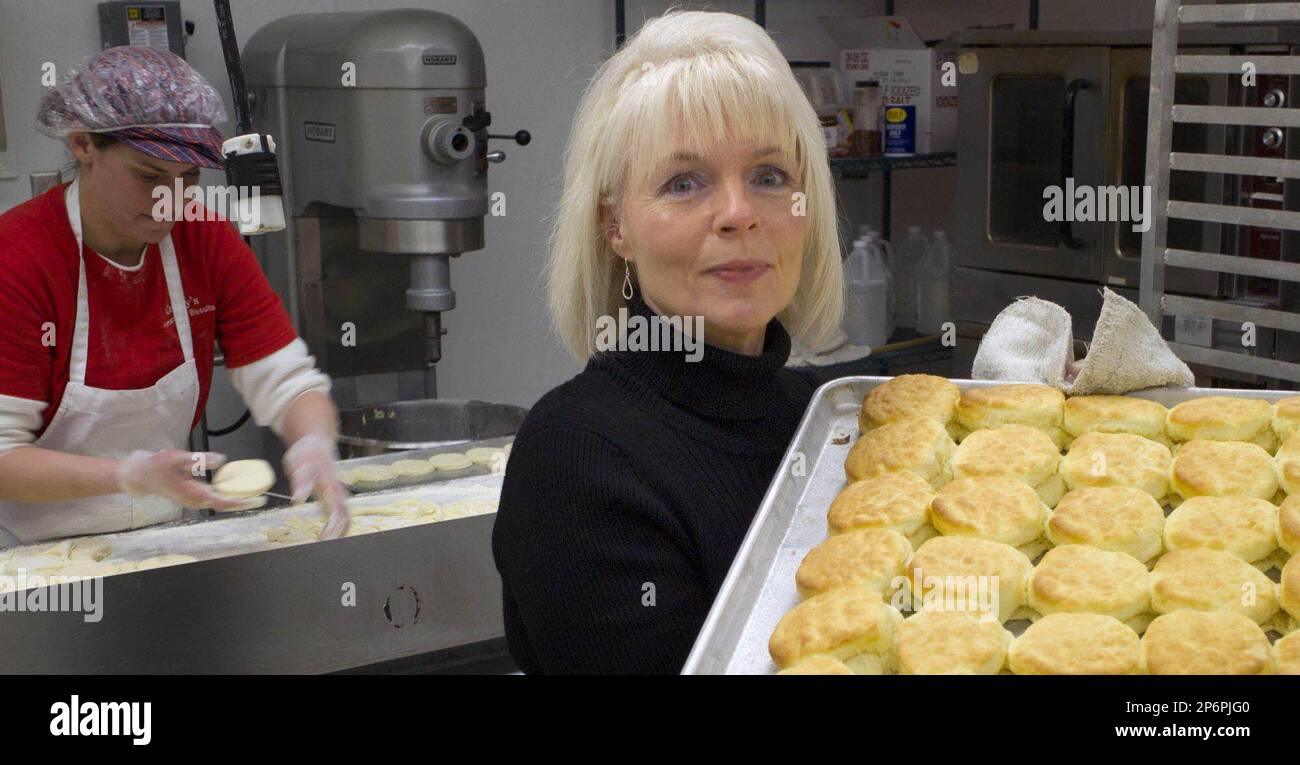 In this Jan. 12, 2012 photo, Cathy Dunn, center, holds a tray of Cathy ...