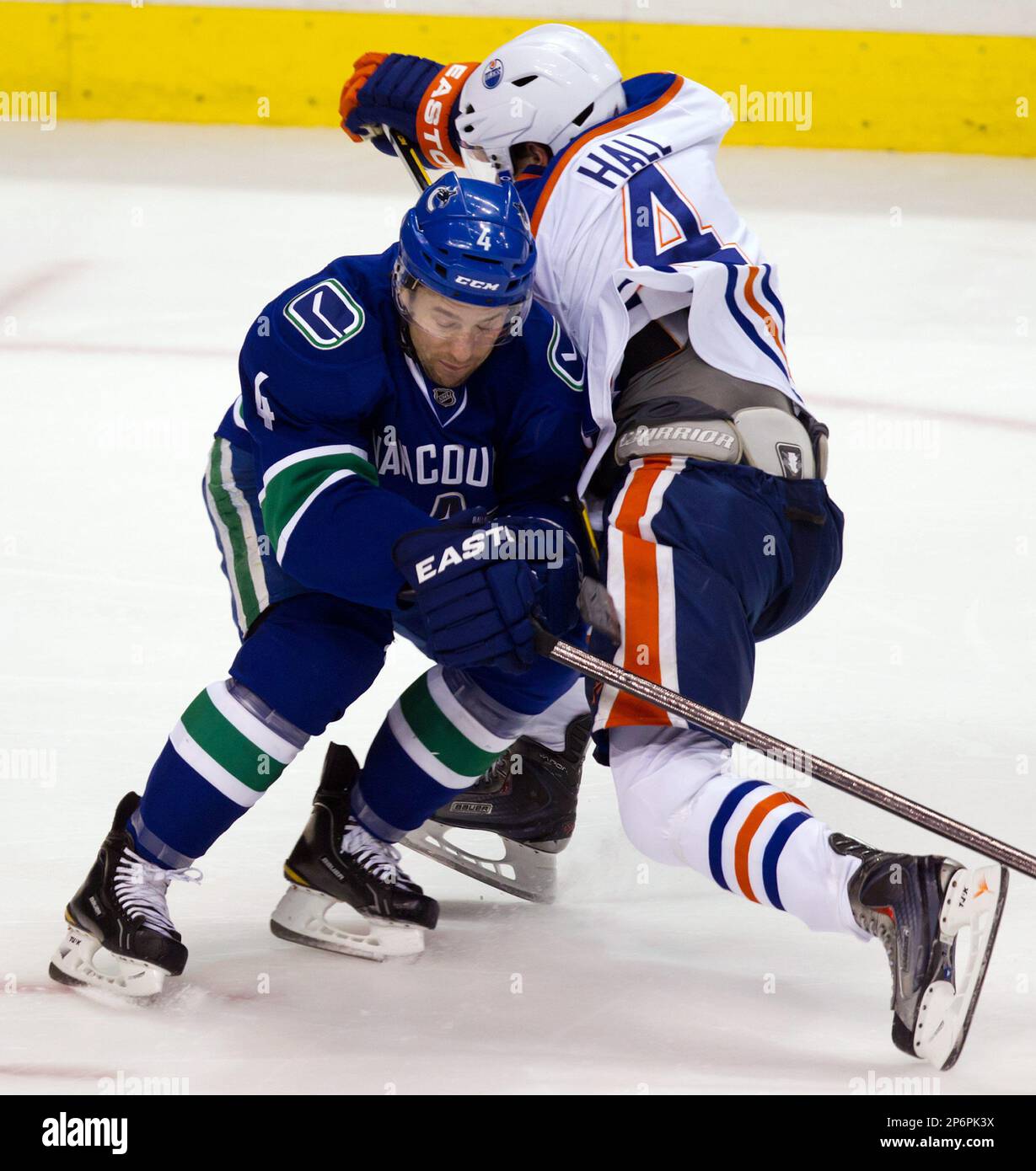 Vancouver Canucks' Keith Ballard, left, checks Edmonton Oilers' Taylor ...