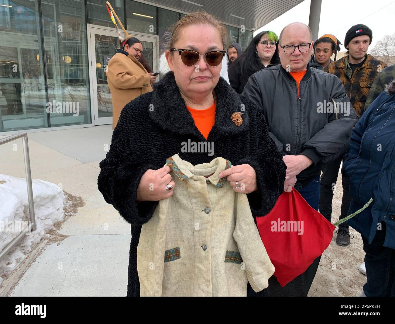 Victoria McIntosh holds a childhood sweater/jacket that her grandmother ...