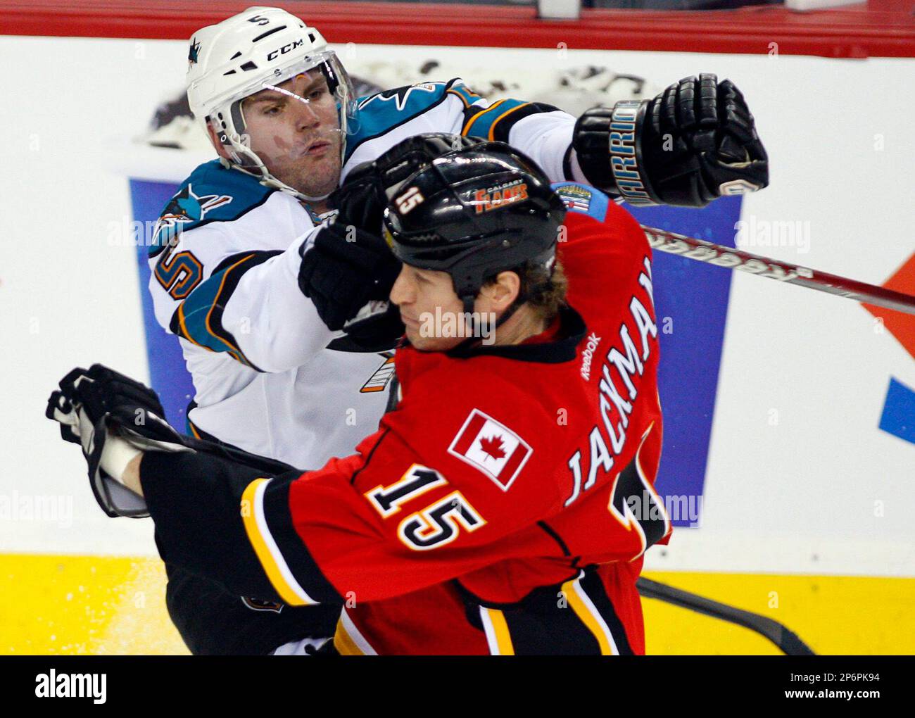 San Jose Sharks' Colin White, left, collides with Calgary Flames' Tim ...
