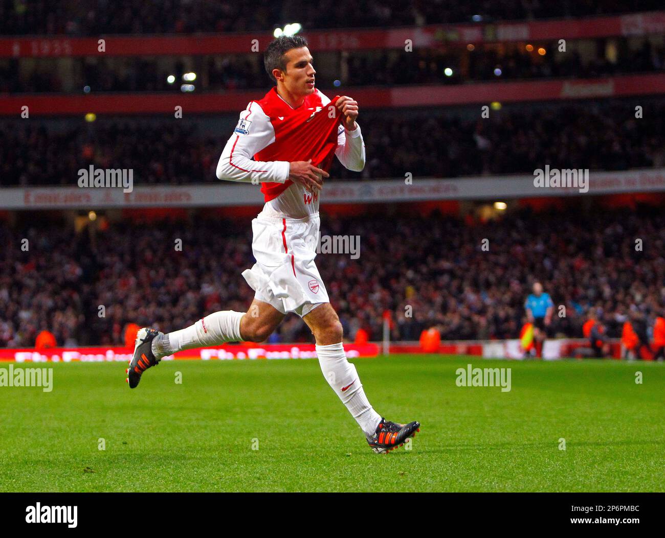 Robin van Persie of Arsenal celebrates scoring his side's first goal ...