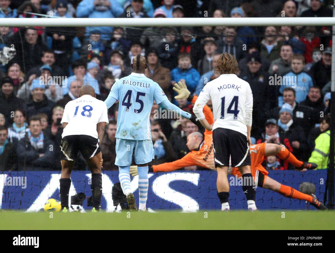 Manchester Citys Mario Balotelli scoring his sides third goal ...