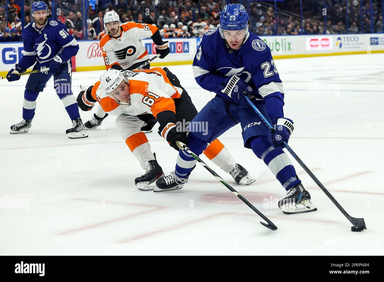 Tampa Bay Lightning's Michael Eyssimont (23) avoids the check of ...