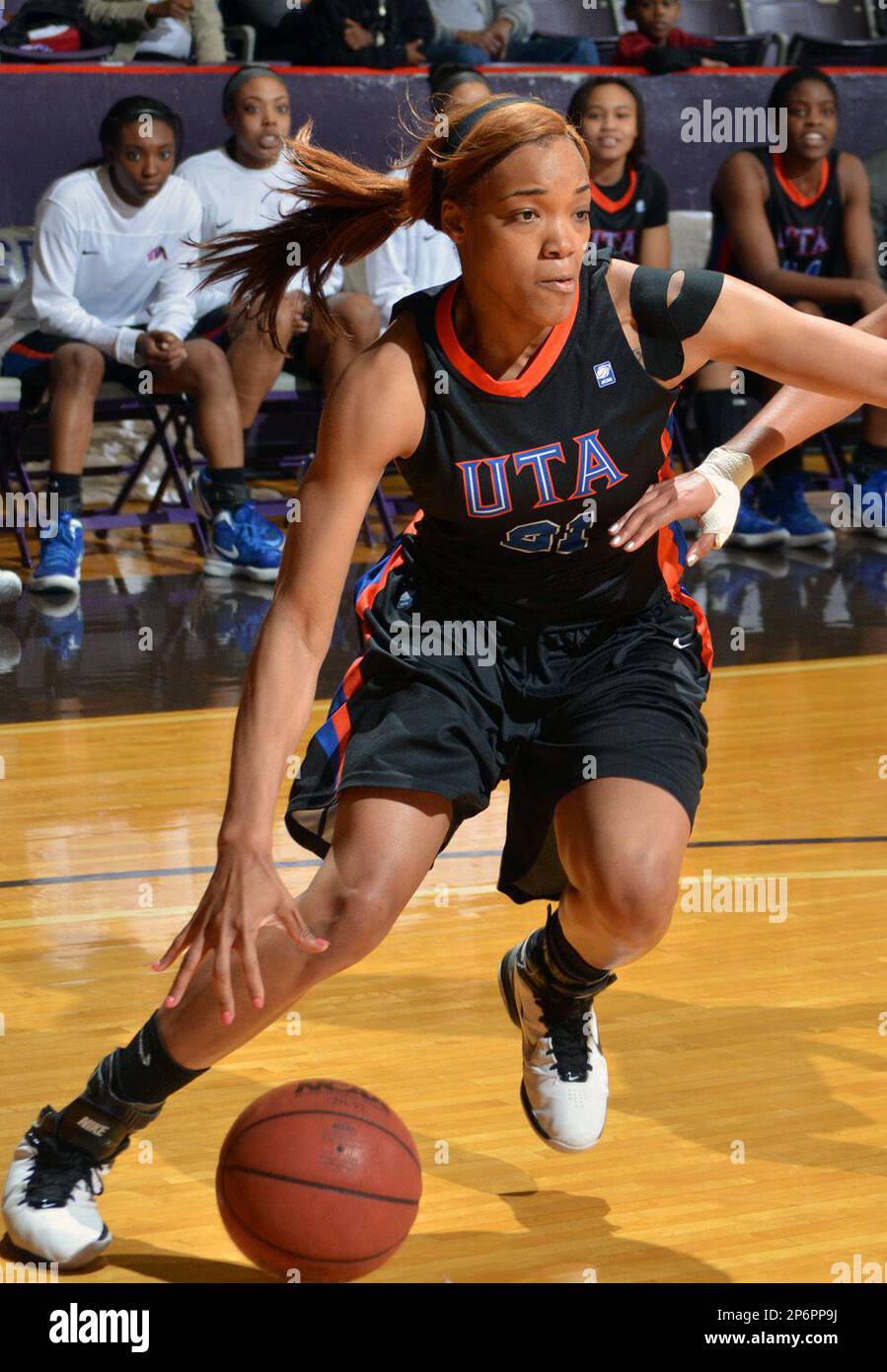 Texas-Arlington forward Briana Walker drives against Stephen F. Austin ...