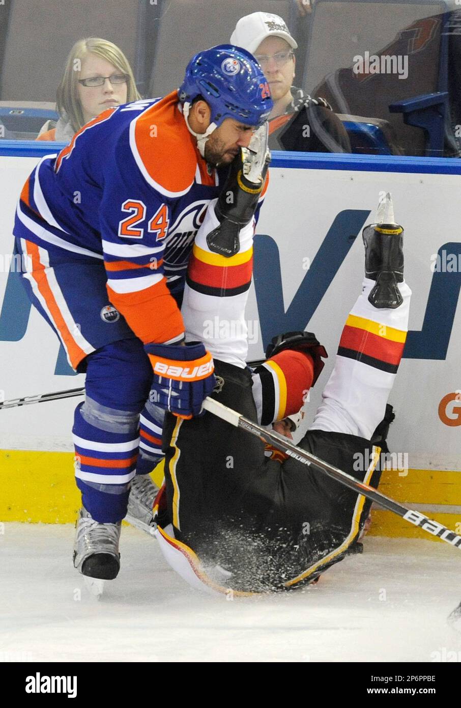 Edmonton Oilers' Theo Peckham takes skate to the face from a Calgary ...