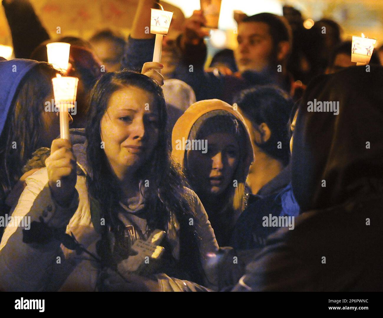 Jessica McLaughlin, the sister of Catherine McLaughlin, clutches a rose ...