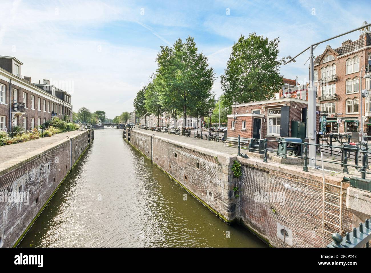 a canal in the middle of an urban area with buildings on both sides and ...