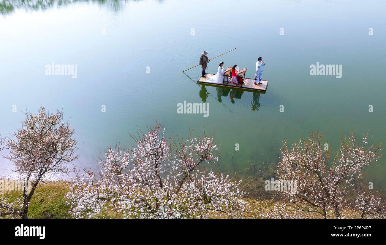 SUQIAN, CHINA - MARCH 4, 2023 - Tourists enjoy boating at a plum garden ...