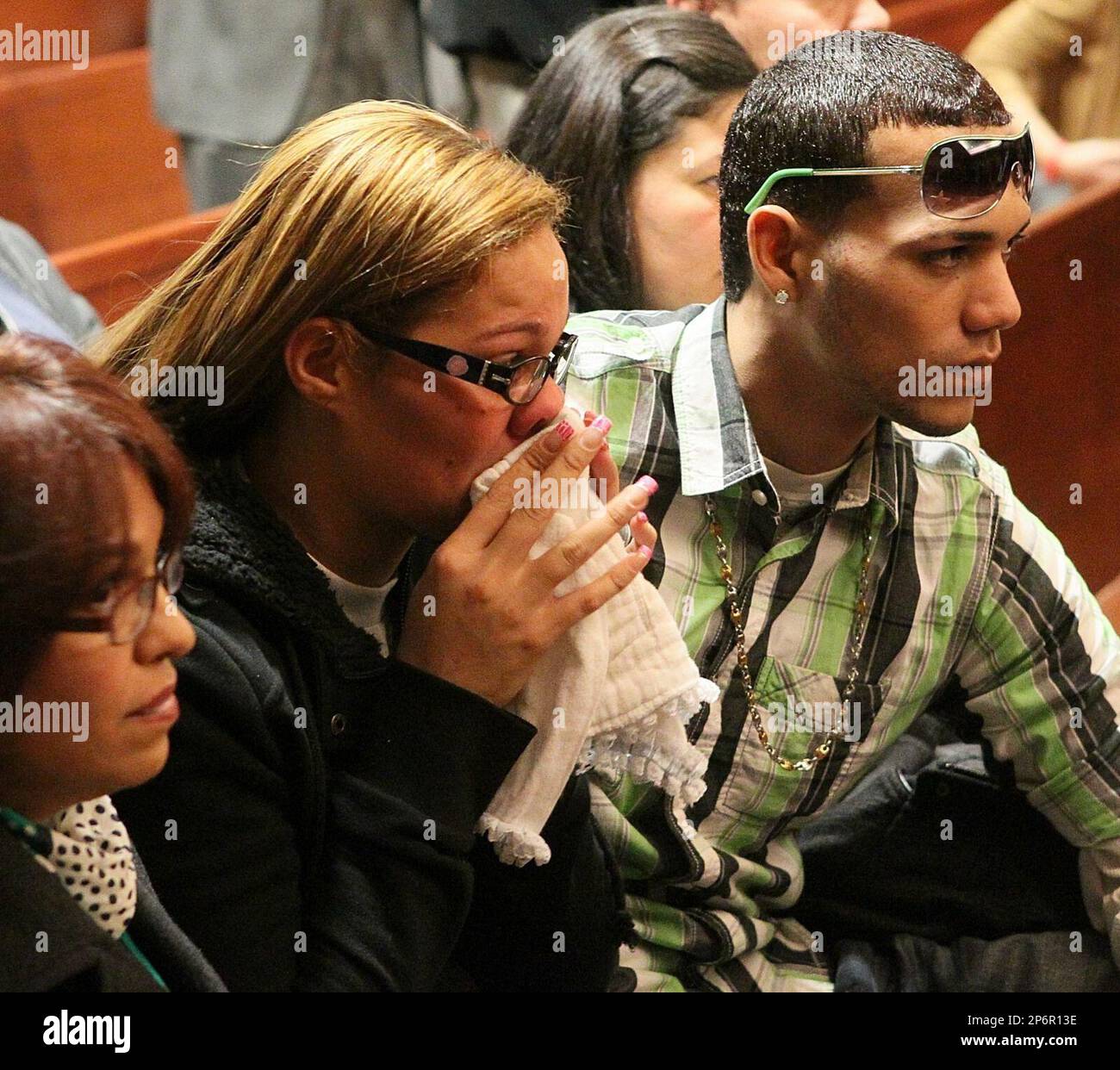 Jocelyn Rivera cries while sitting with family members as Ryan Brunn ...