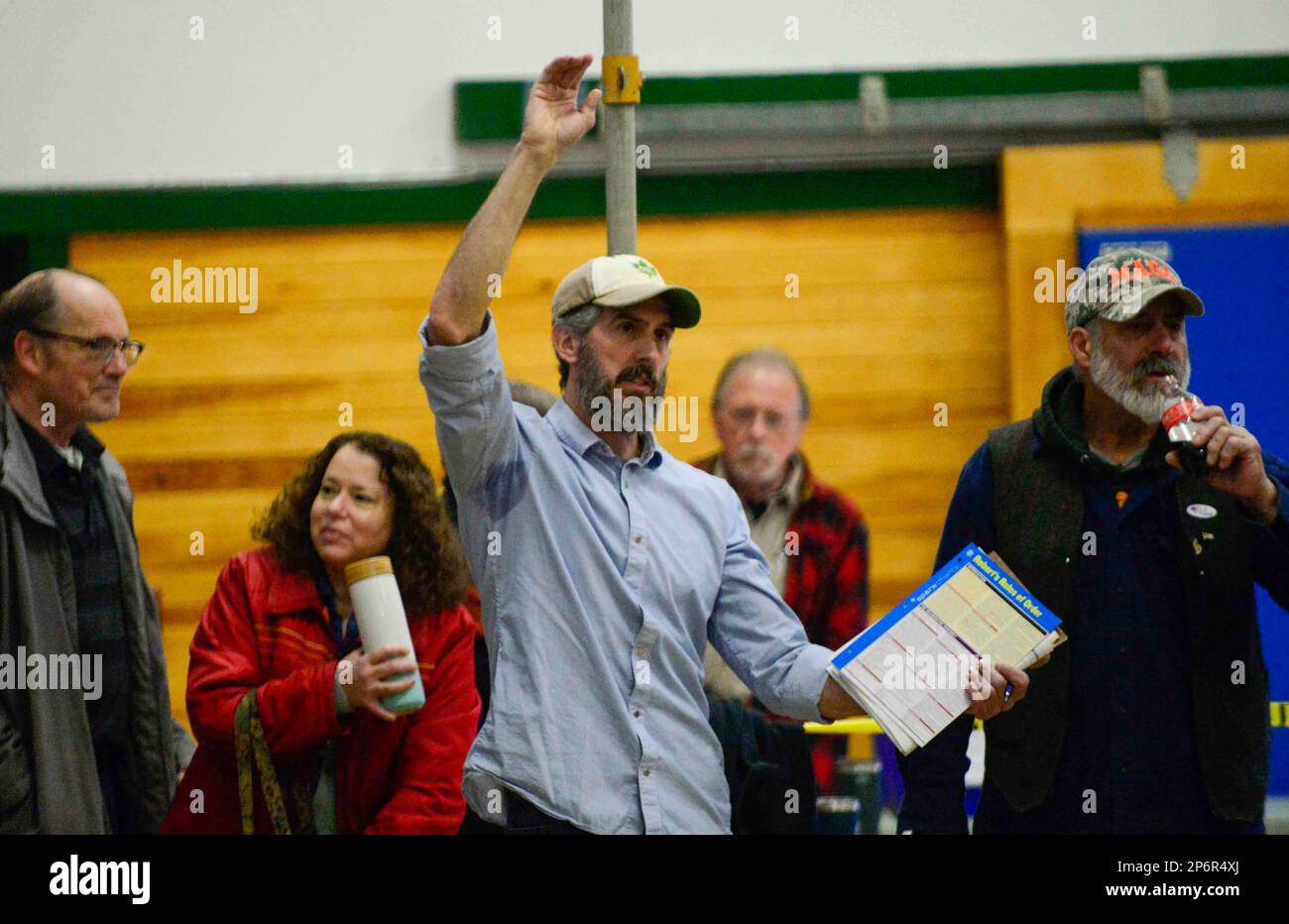 Guilford, Vt., resident Jason Harron raises his hand to ask a question ...