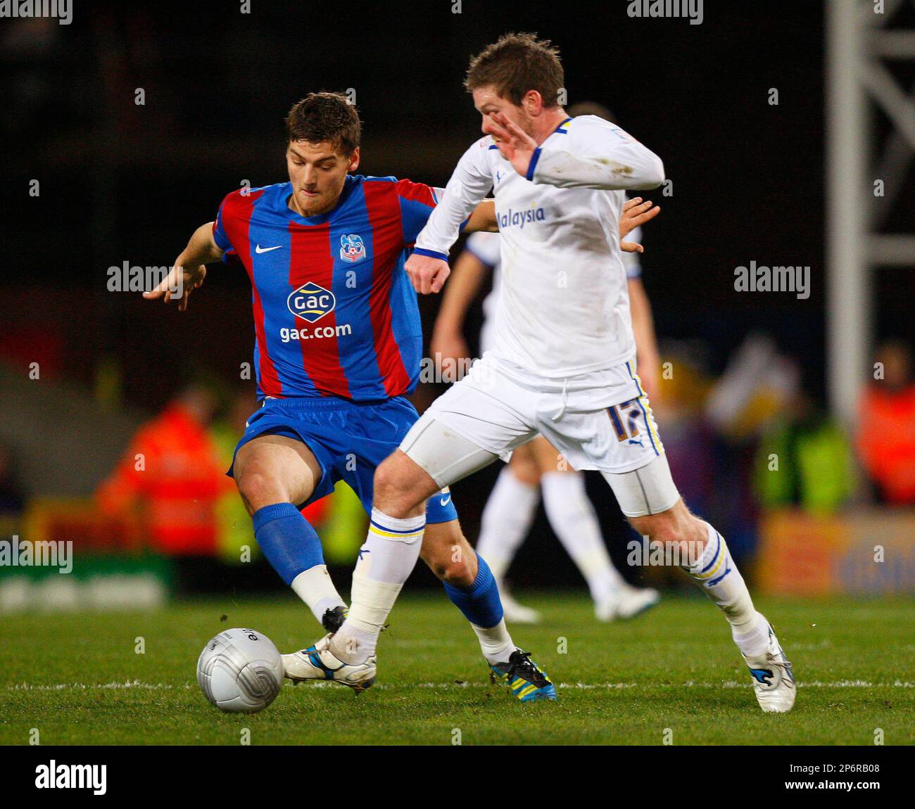 Aron Gunnarsson of Cardiff City holds off Chris Martin of Crystal ...