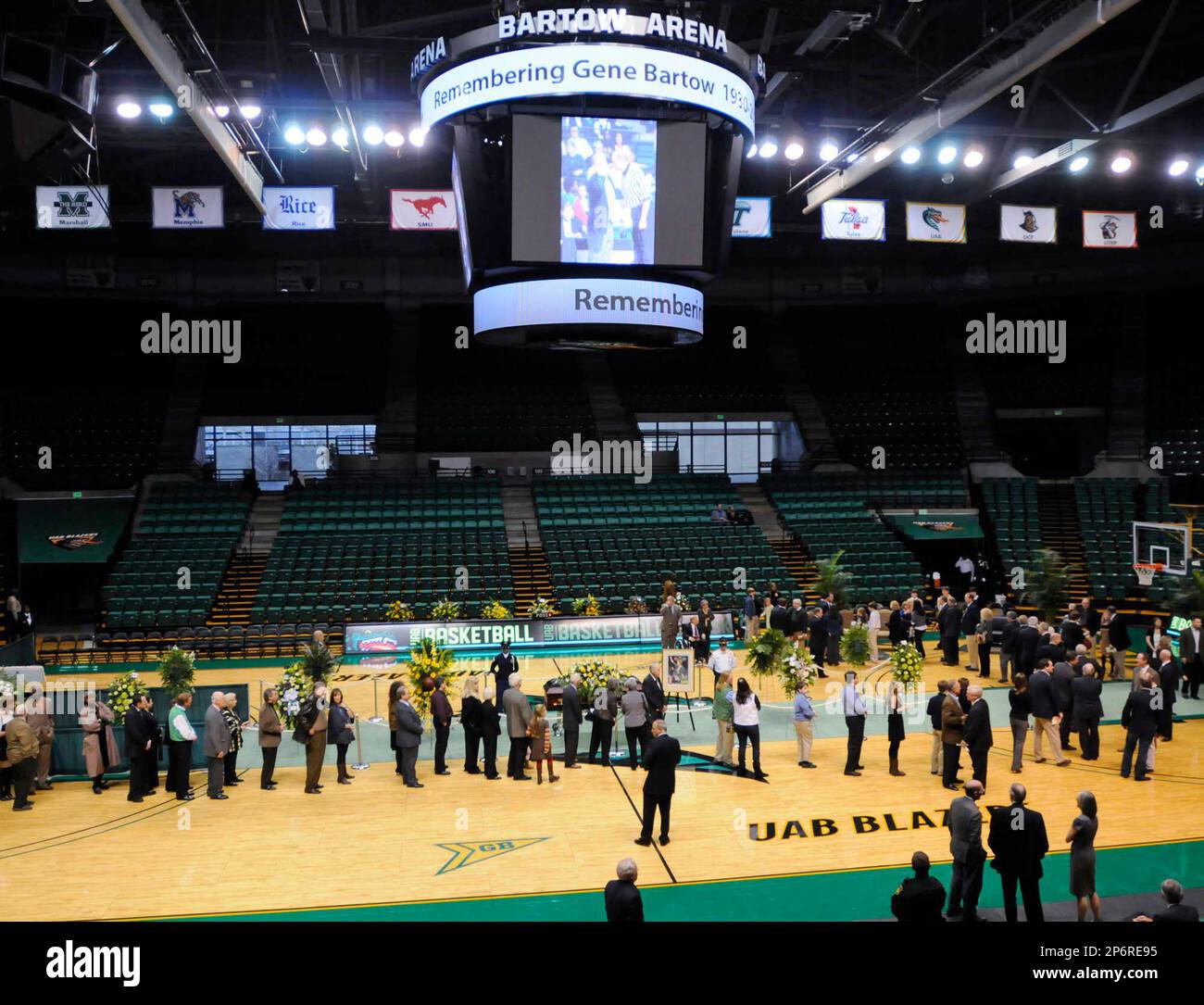 People file past the casket as people pay their respects to Gene Bartow ...