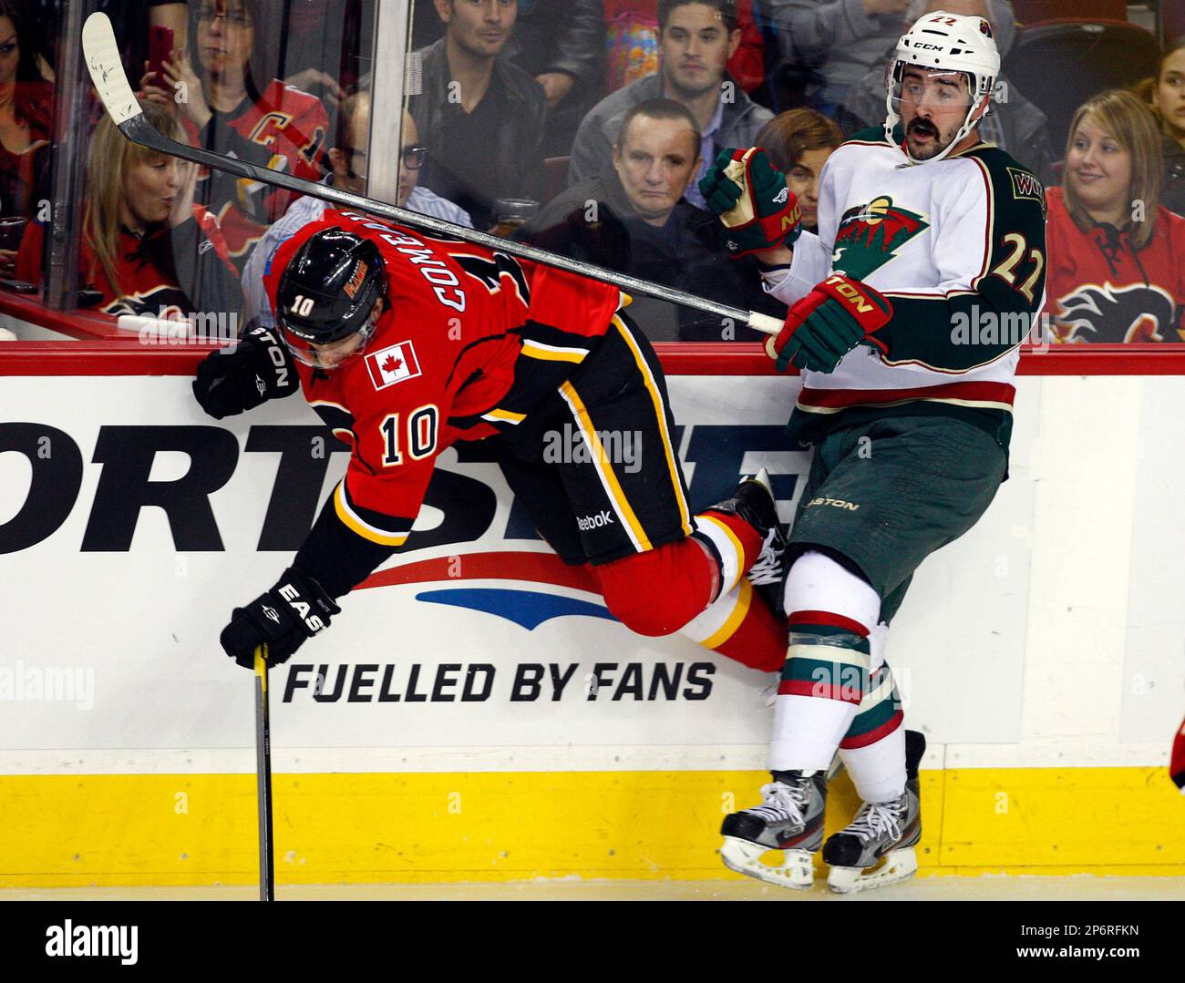 Minnesota Wild's Cal Clutterbuck, right, checks Calgary Flames' Blake ...
