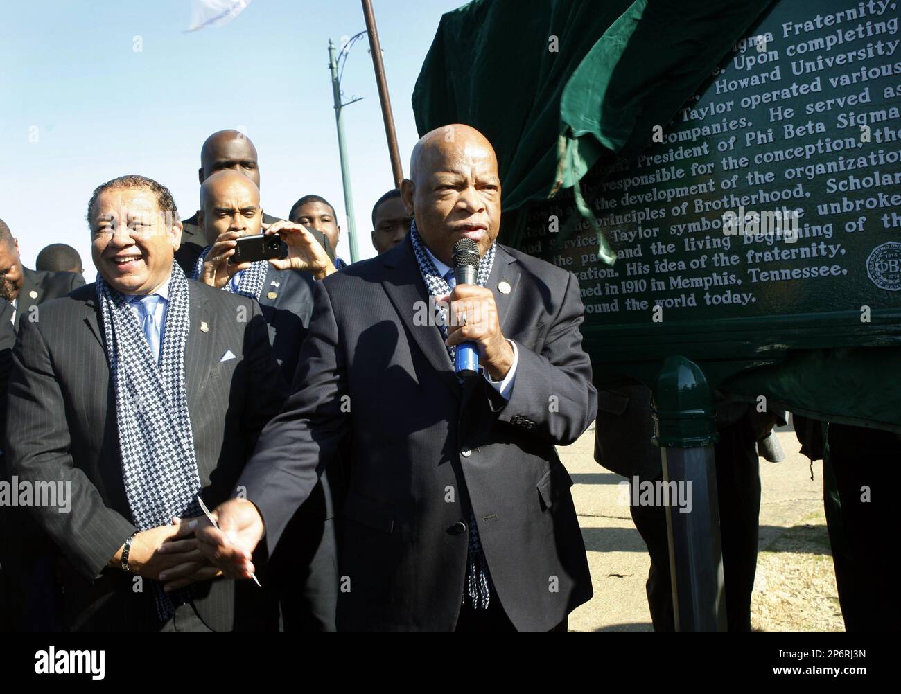 From left, Arthur Thomas and John Lewis unveil a marker to honor Abram ...