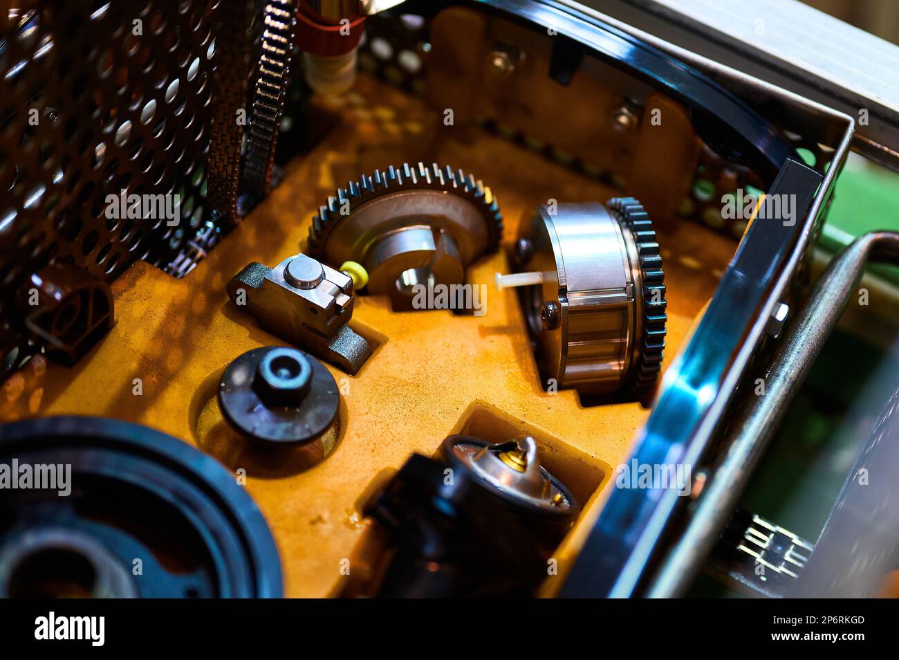 Various parts for assembly during the assembly of an automobile engine ...