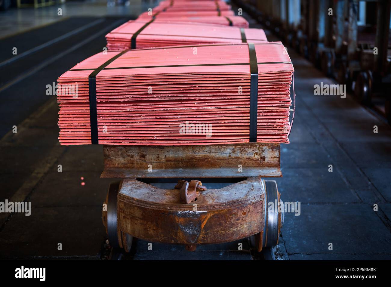Cathode copper sheets on rail carriages in warehouse Stock Photo - Alamy