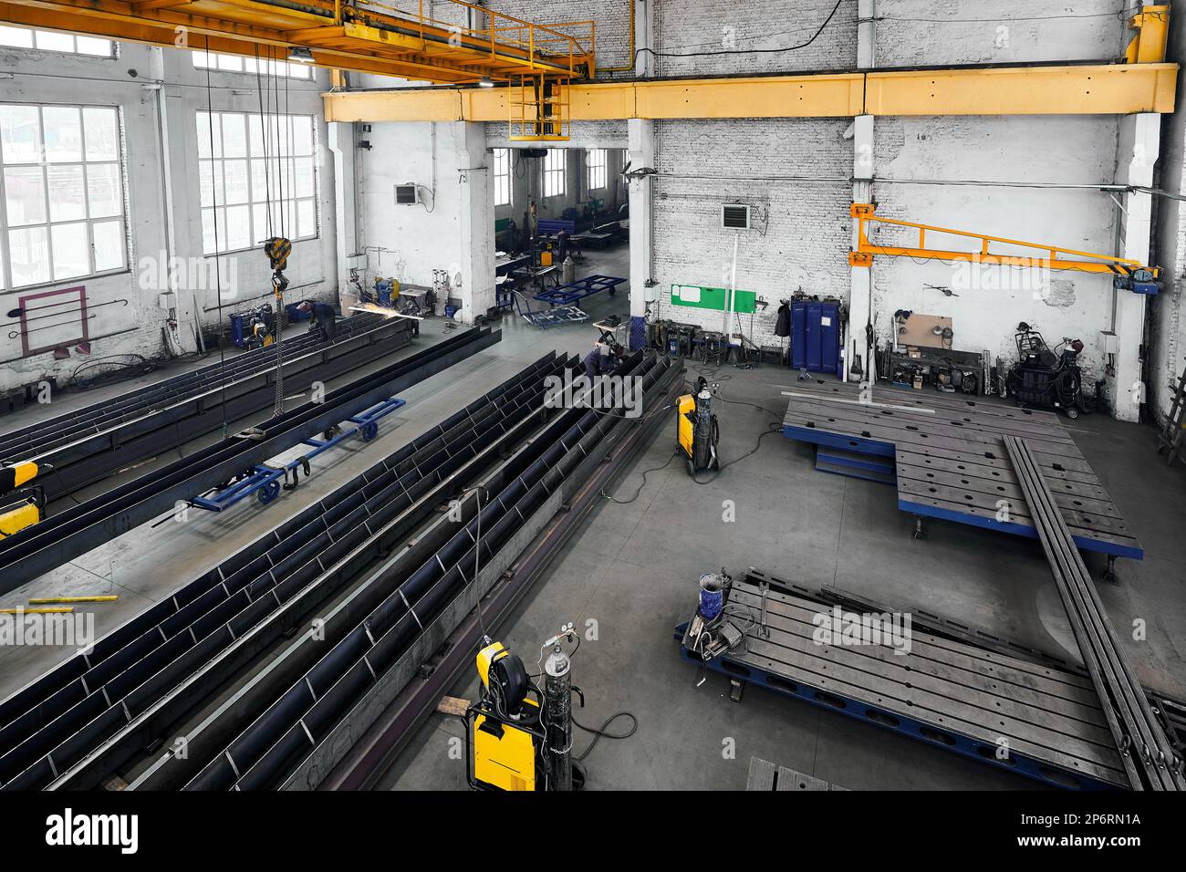 Long steel constructions assembling with welding in workshop Stock ...