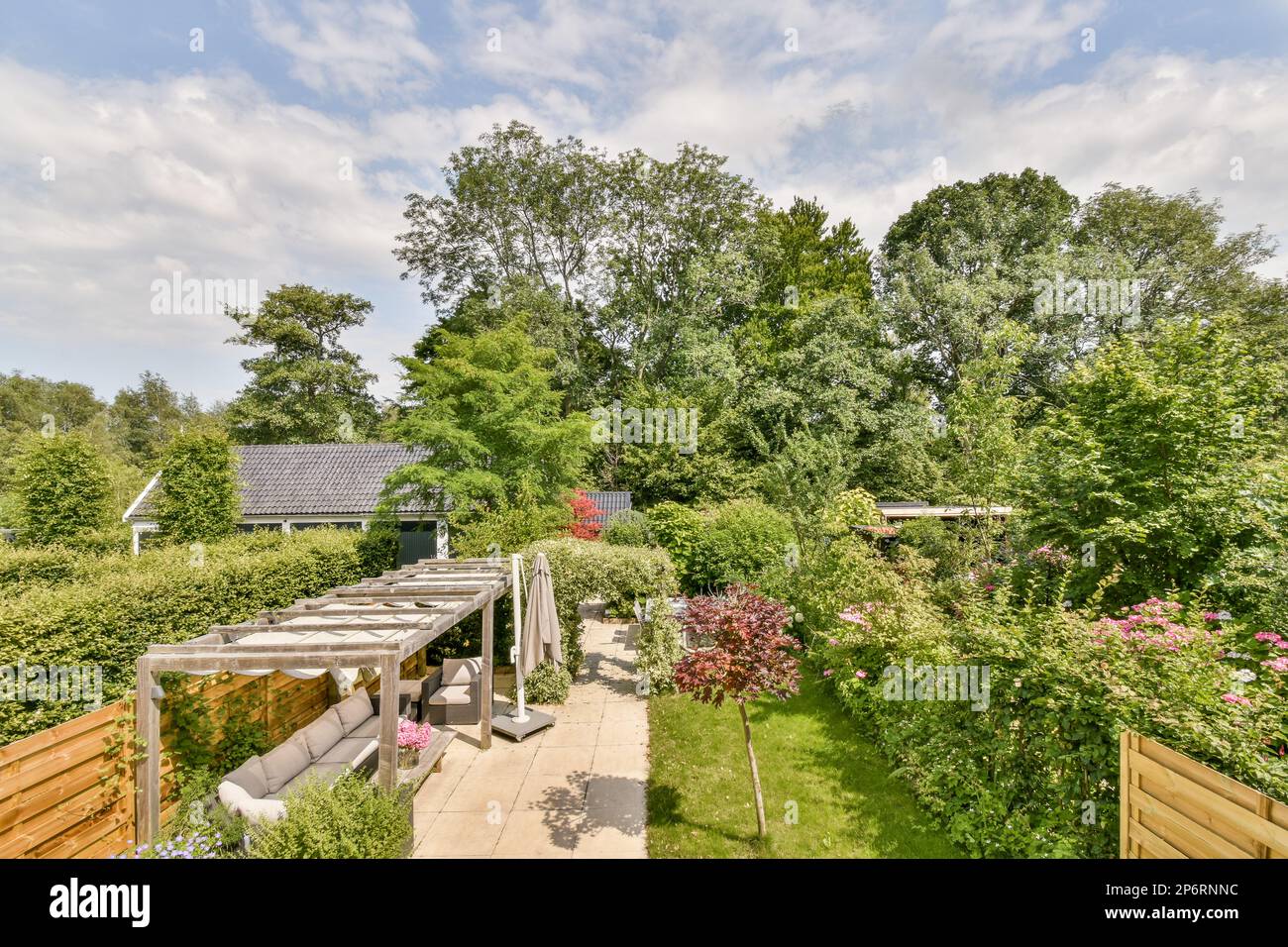 Amsterdam, Netherlands - 10 April, 2021: a backyard with lots of trees ...