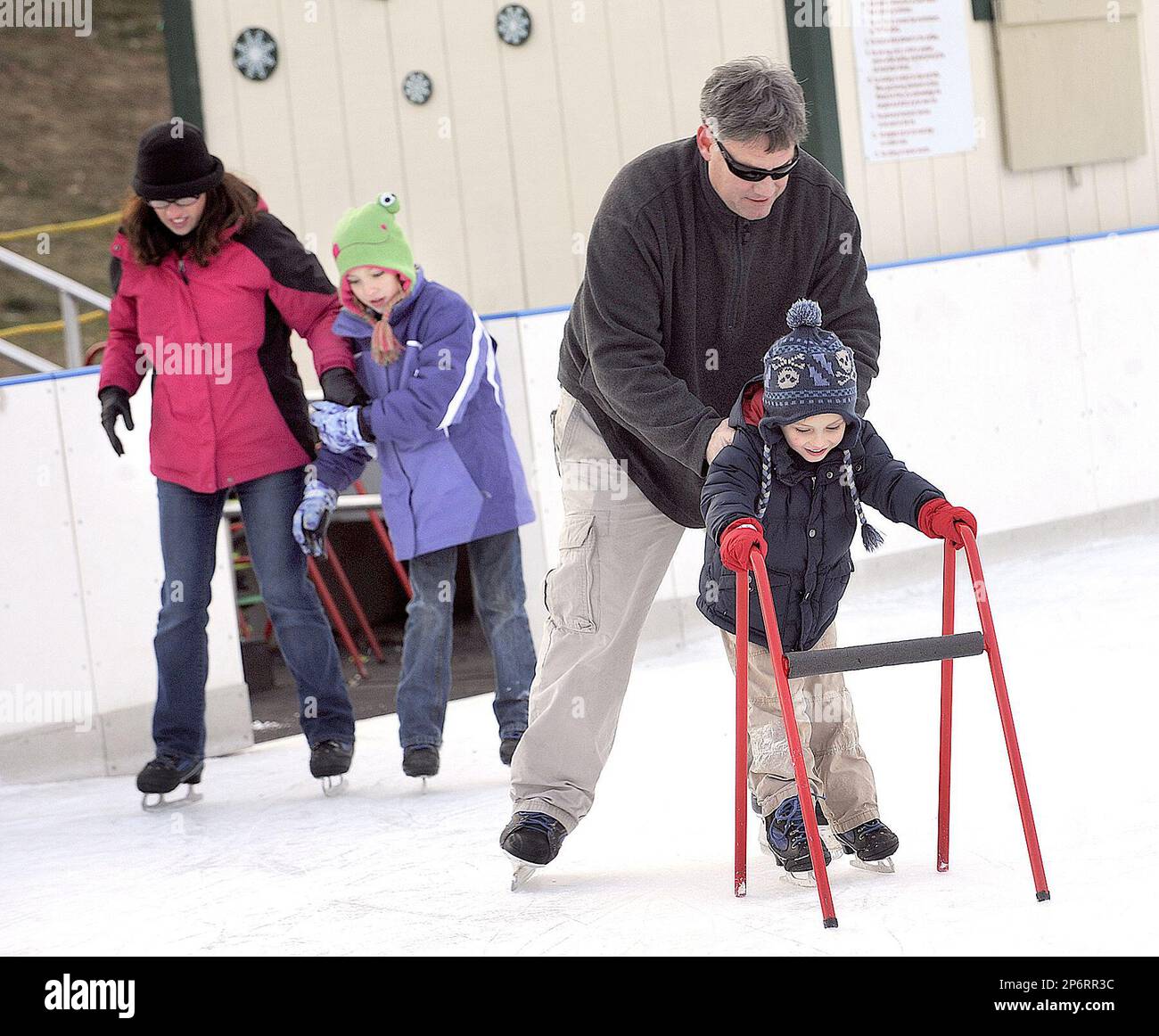 In this Wednesday, Jan. 4, 2012 photo, Noel Patterson gives his son ...