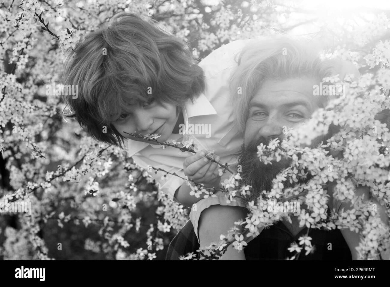 Spring happy family outdoor. Child with dad in summer park. Shoulder ...