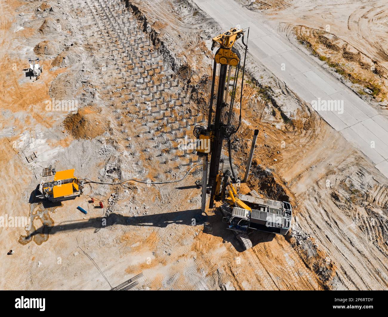 Drilling rig for constructing new mine on pile field Stock Photo - Alamy
