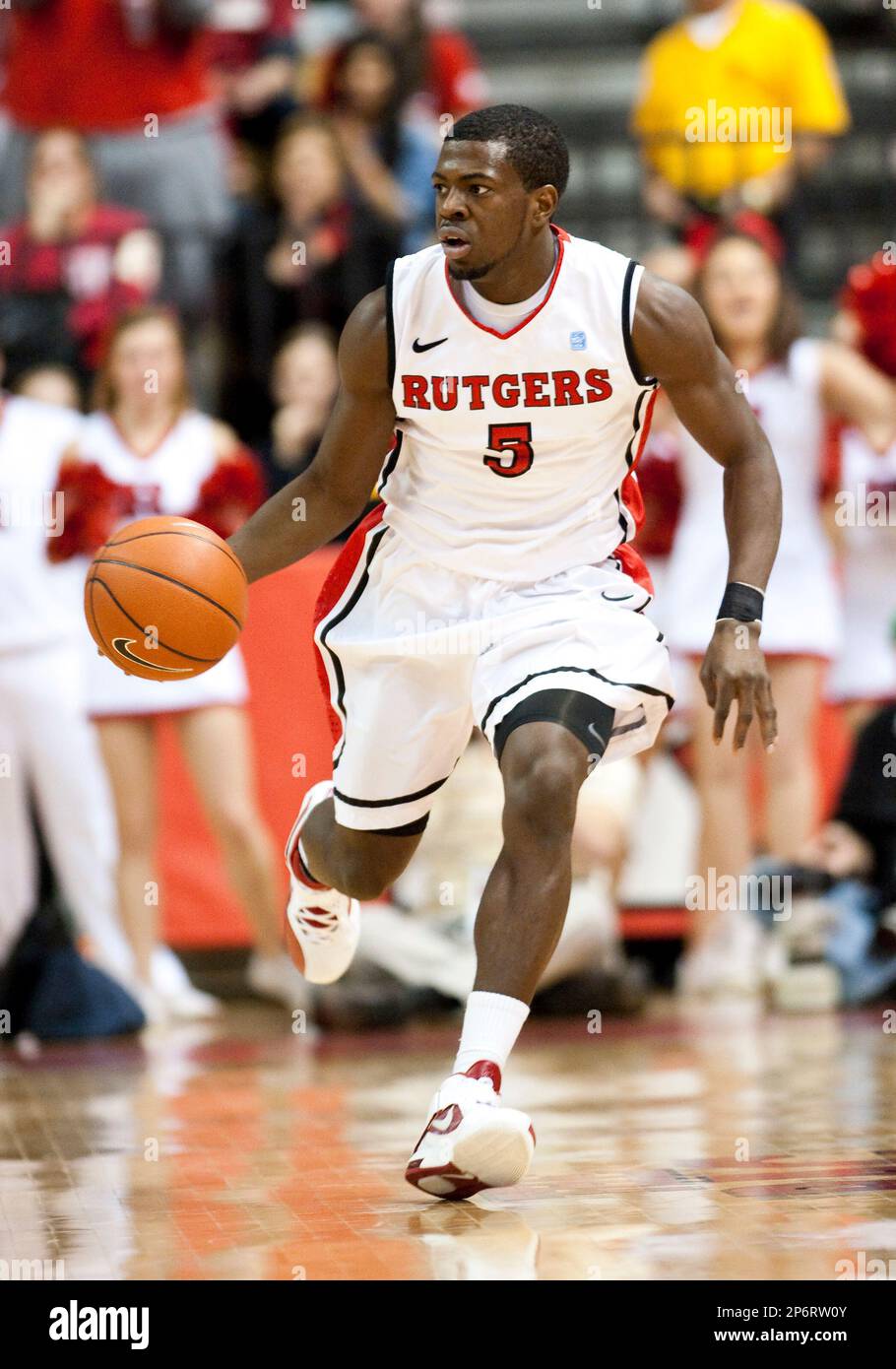 January 4 2012: Rutgers' Eli Carter (5) pushes the ball up court in the ...