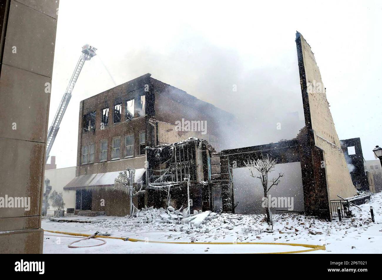 Firefighters hose down a burning building in downtown Beckley W. Va ...