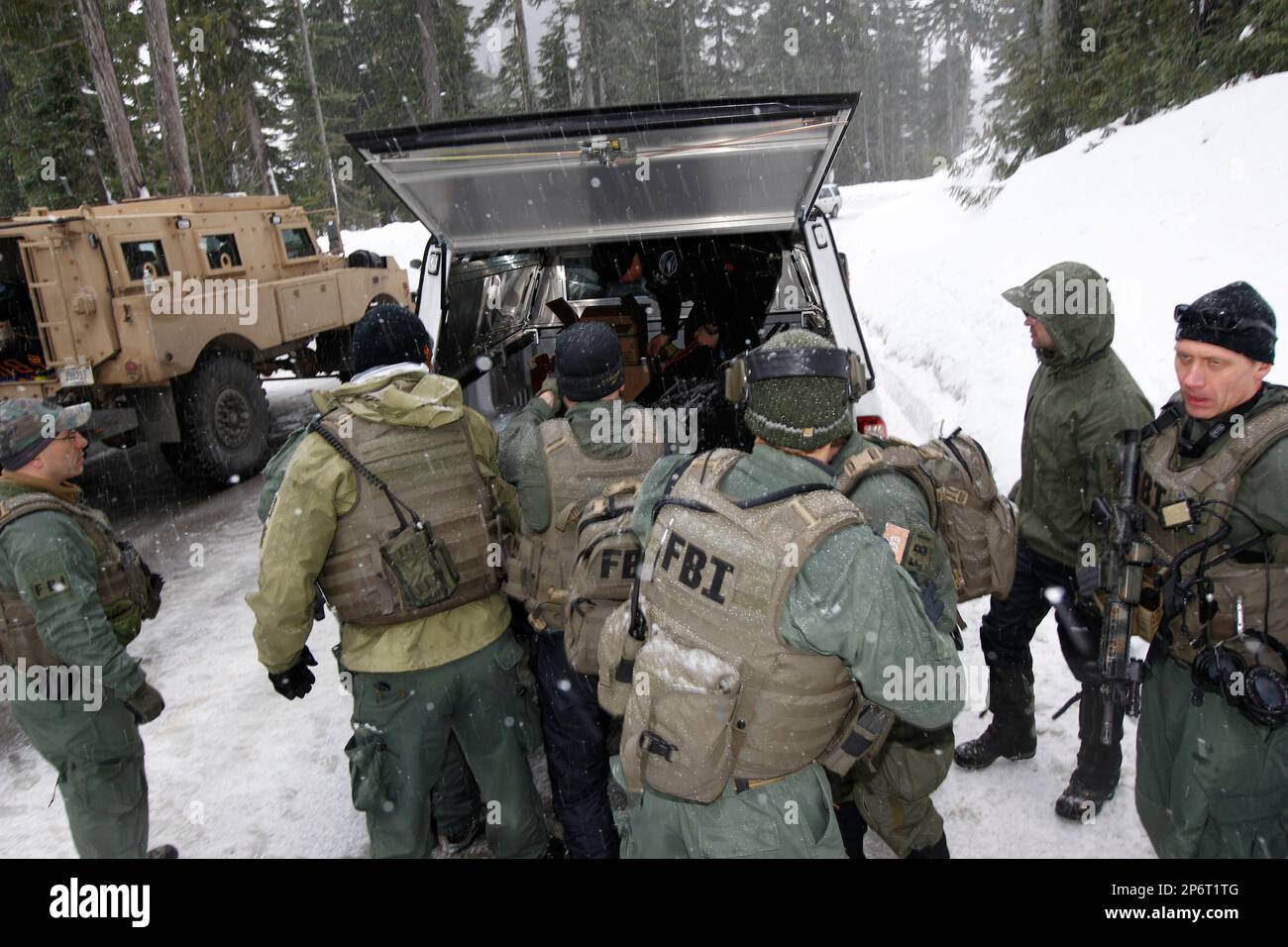 In this photo provided by the Pierce Co. Sheriff's Dept., FBI SWAT team ...