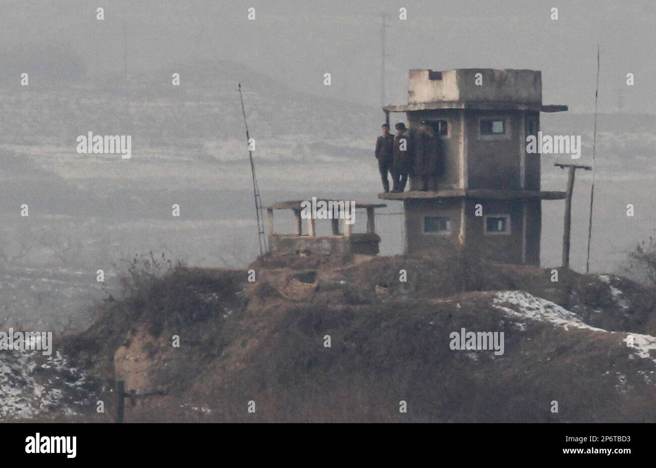 North Korean soldiers stand on their observation post near Panmunjom ...