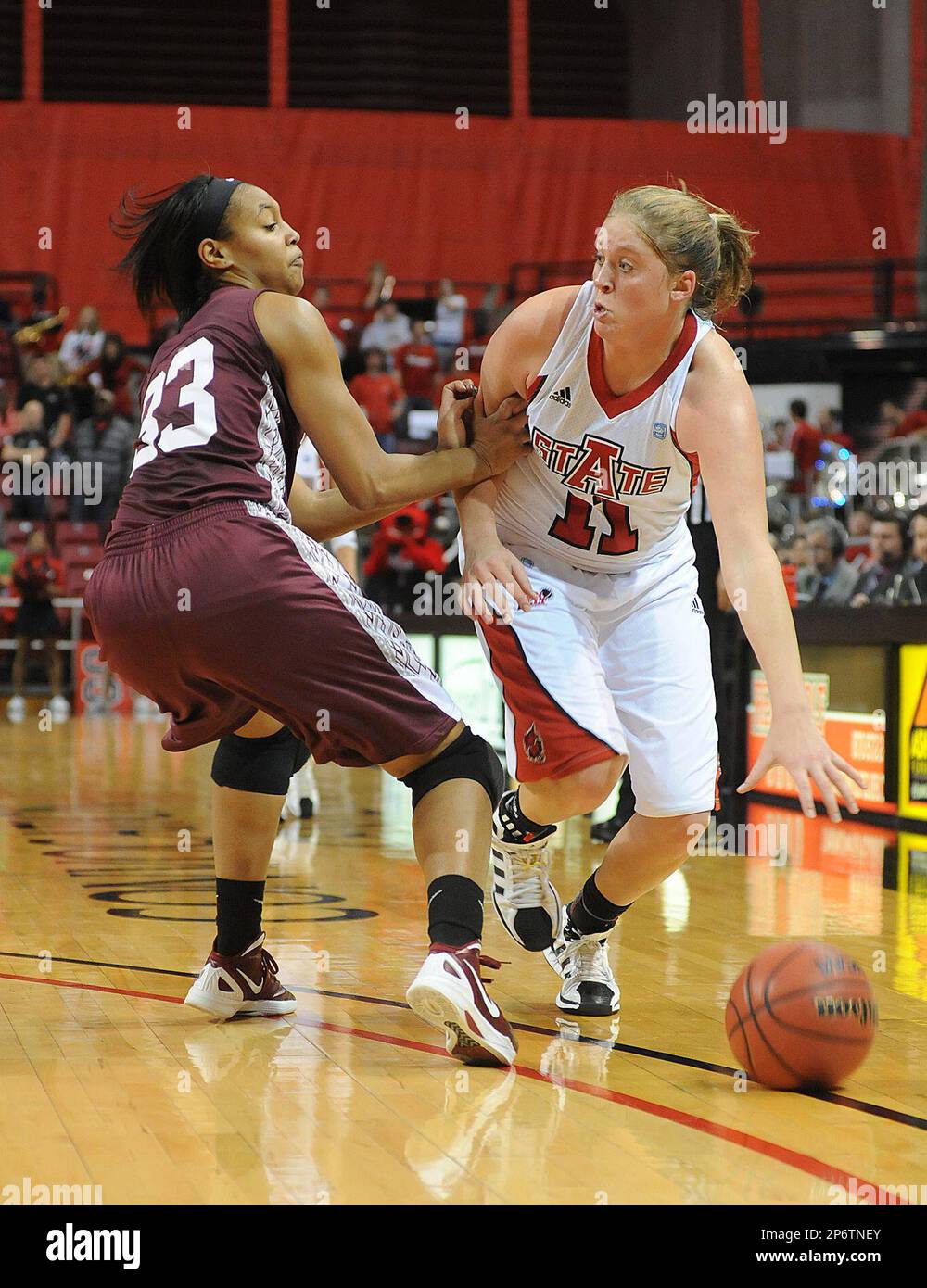 Arkansas State's Jane Morrill (right) tries to dribble past Missouri ...