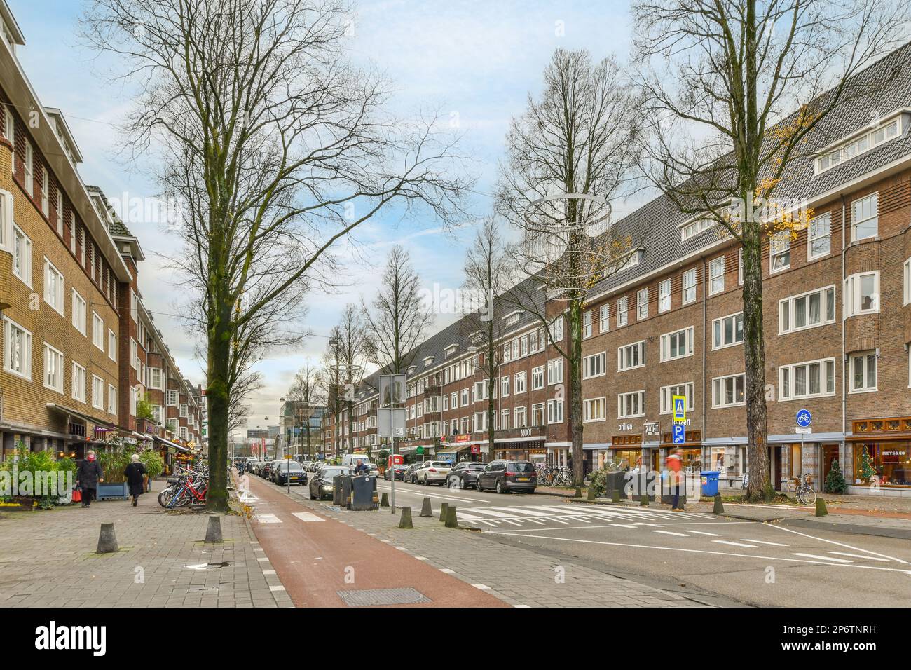 Amsterdam, Netherlands - 10 April, 2021: a city street with cars parked ...