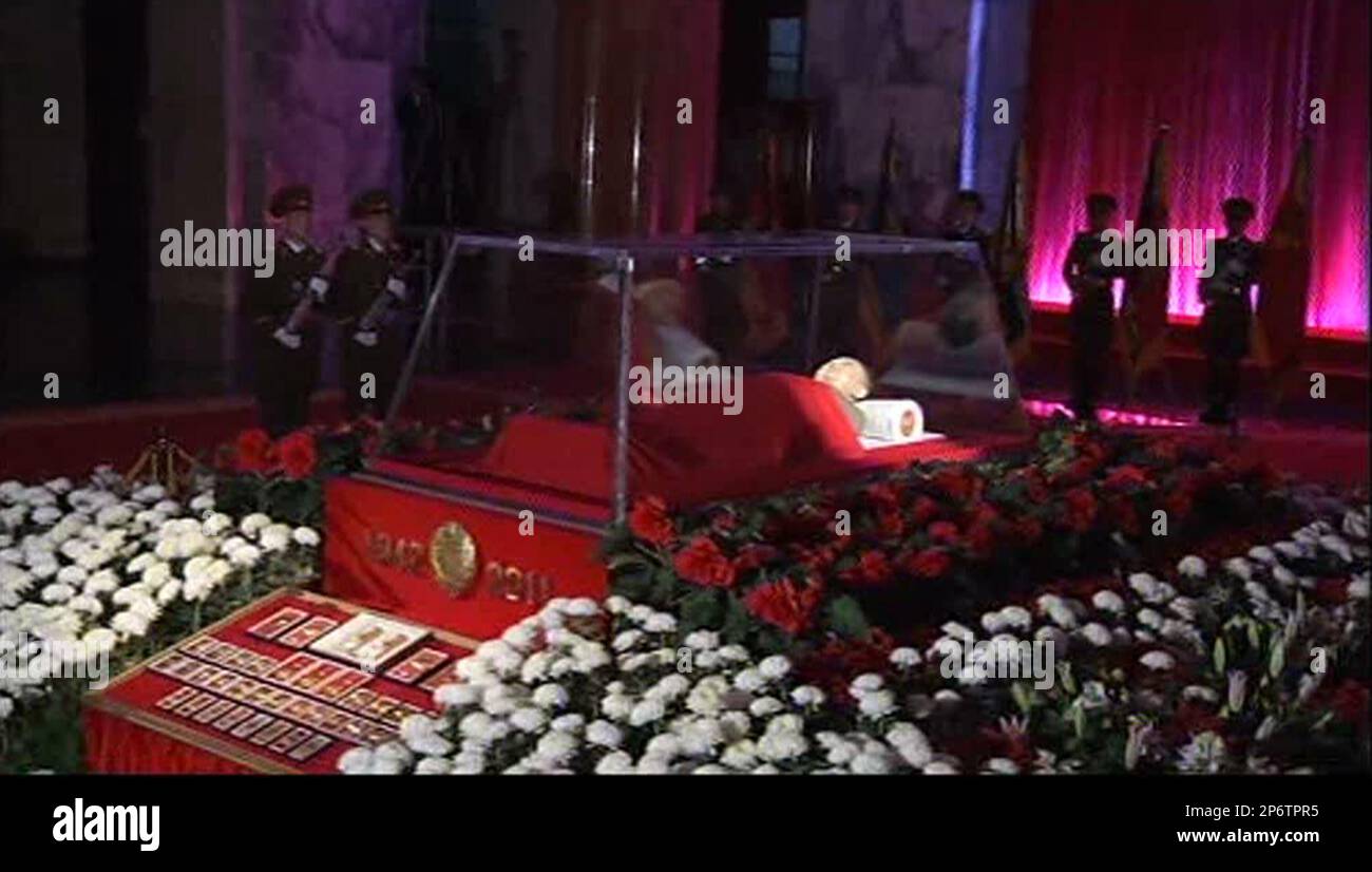 In this image made from AP video, North Korean leader Kim Jong Il lies ...