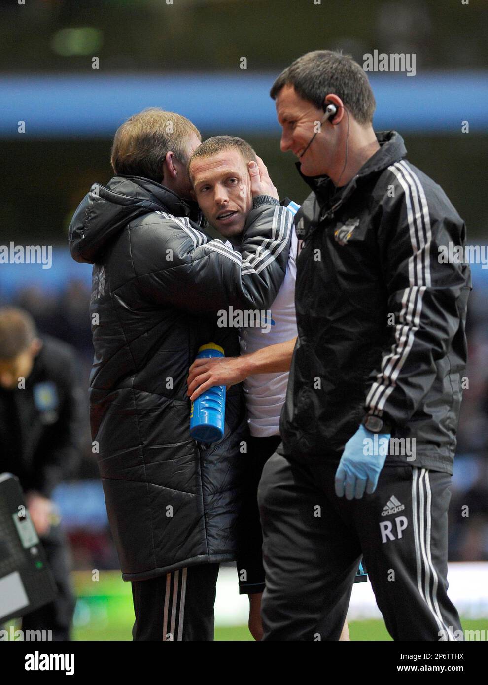 Liverpool manager Kenny Dalglish hugs goalscorer Craig Bellamy ...