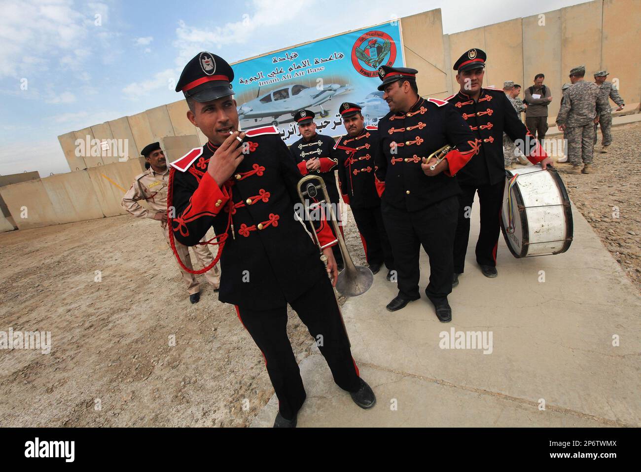 In this Dec. 16, 2011 photo, Iraqi Army band members look on in front ...