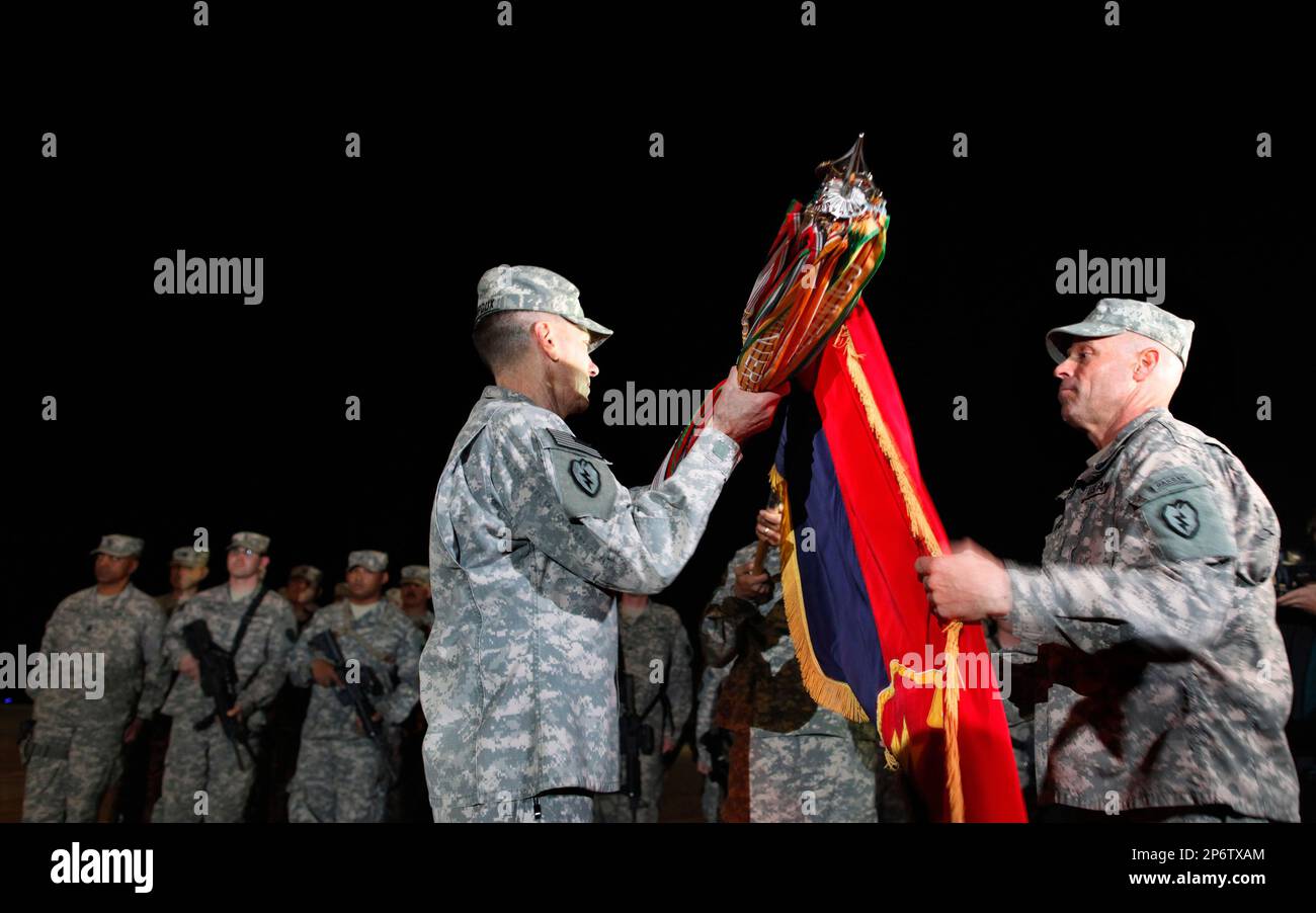 U.S. Army soldiers perform a casing of the colors ceremony signifying ...