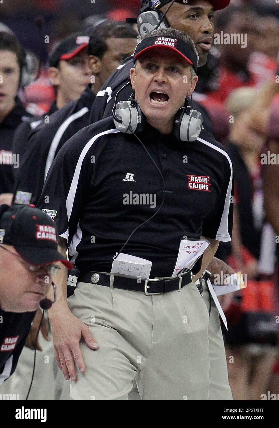 Louisiana-Lafayette head coach Mark Hudspeth yells to his team during ...