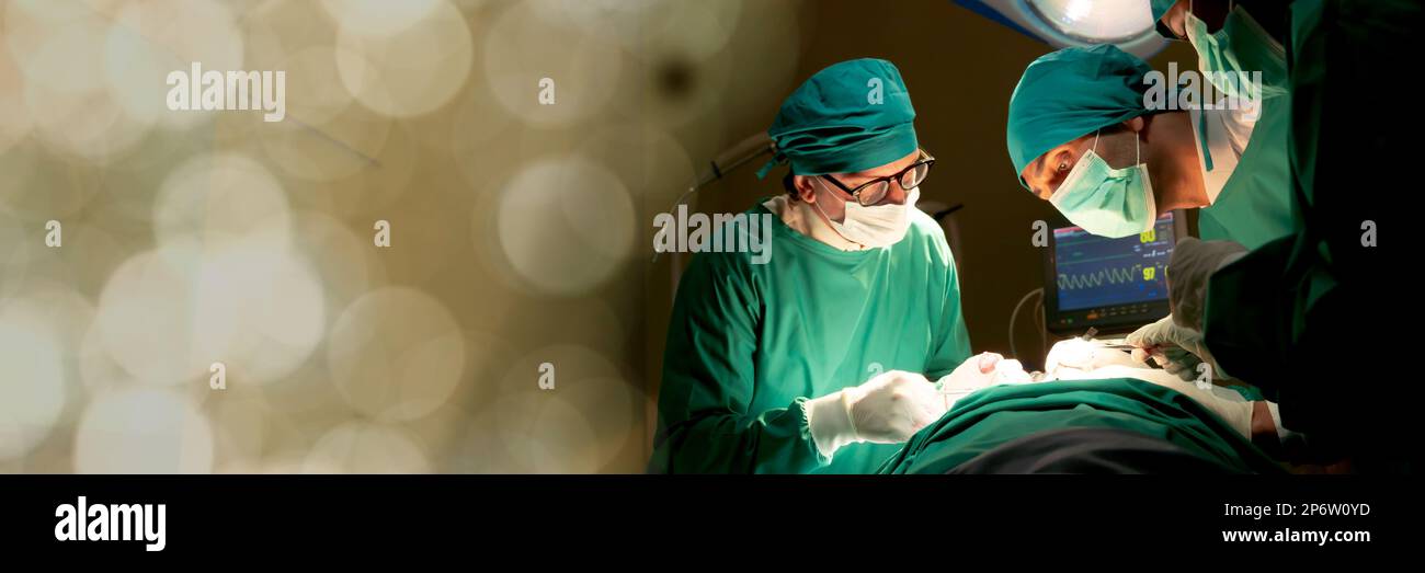Web banner Team doctors in operating room dressed green uniform saving ...