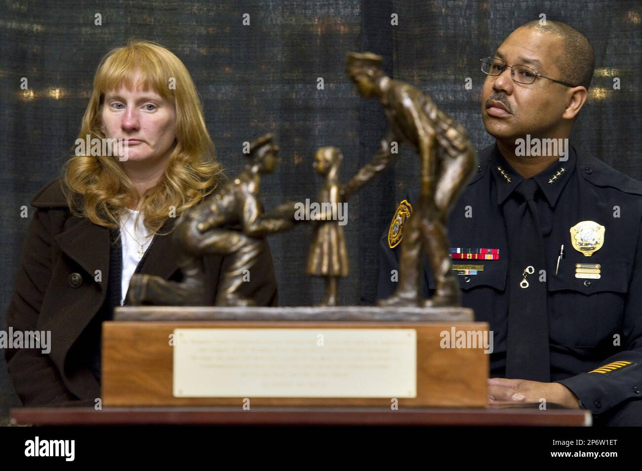 Betsy Warren, left, wife of late police officer Timothy Warren, who was ...