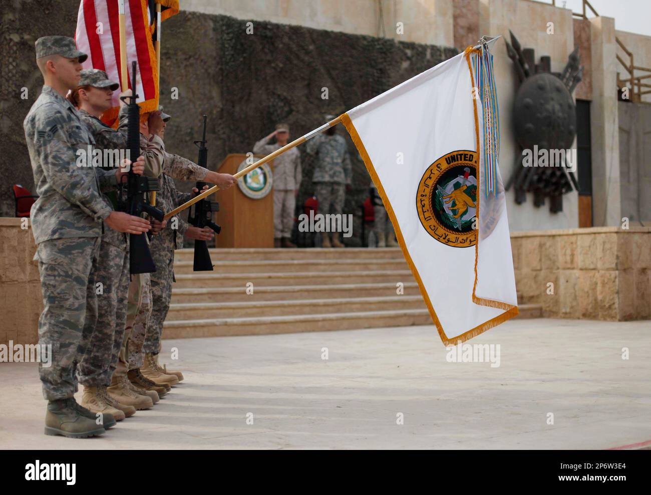 The flag used by U.S. forces in Iraq is lowered before being encased ...