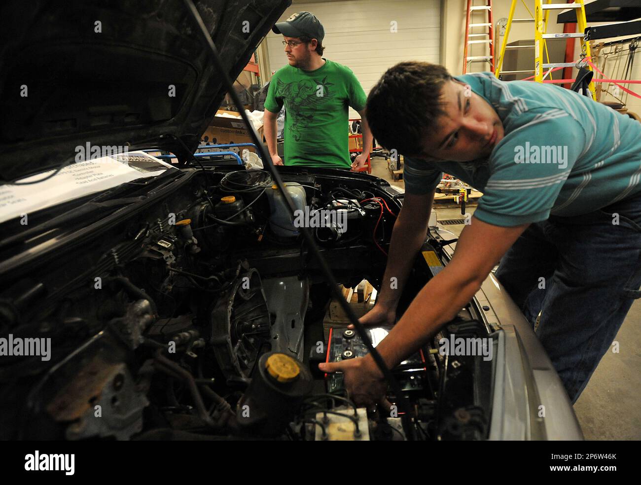 Andrew Twining, a mechanical engineering major, demonstrates how a ...